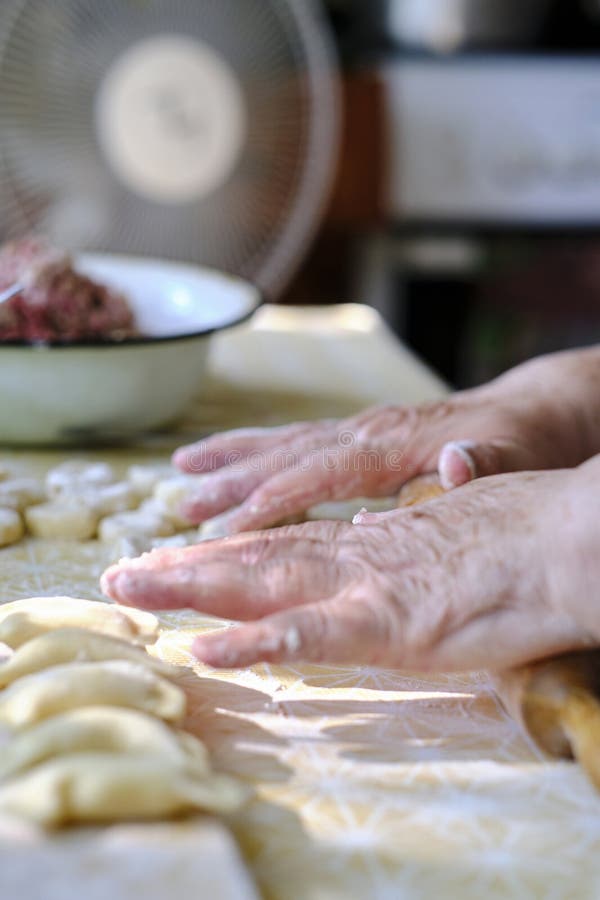 Rolling Out Dough with Rolling Pin and Hands for Cooking Dumplings ...