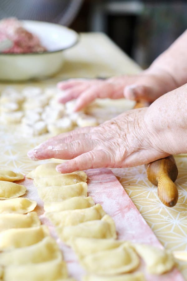 Rolling Out Dough with Rolling Pin and Hands for Cooking Dumplings ...