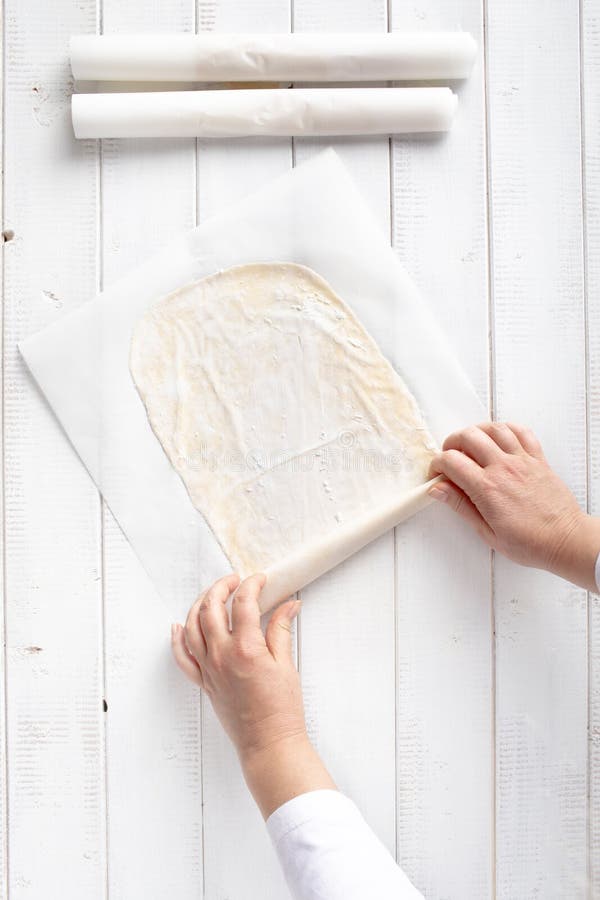 Rolling Phyllo Dough in a Sheet of Kitchen Paper Stock Image - Image of ...