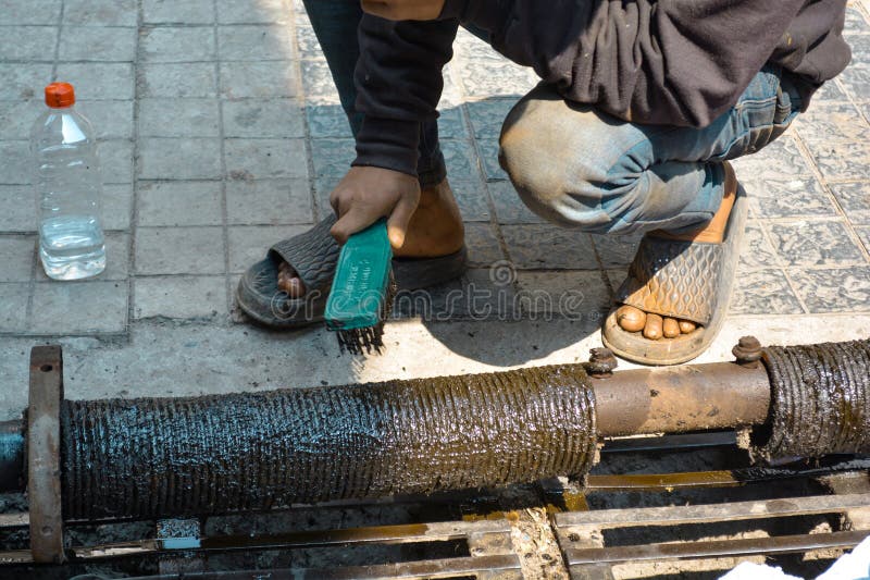 Rolling Shutter Spring Unit Repair and Cleaning & Brushing Stock Photo ...