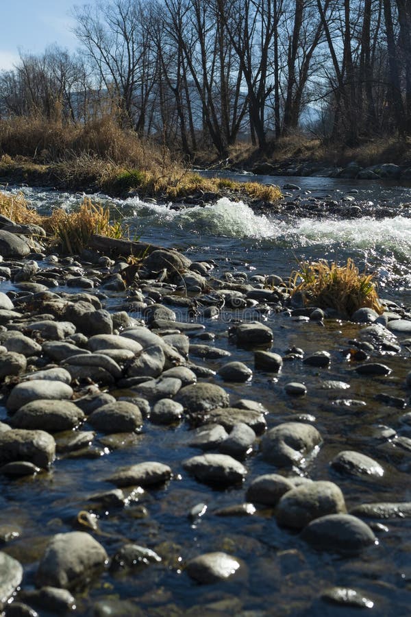 Rolling Stones on a River Water Edge Landscape Stock Image - Image of ...
