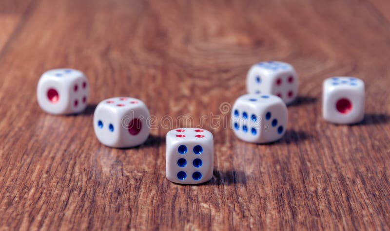 Rolling Three Dice on a Wooden Desk Stock Photo - Image of colors ...