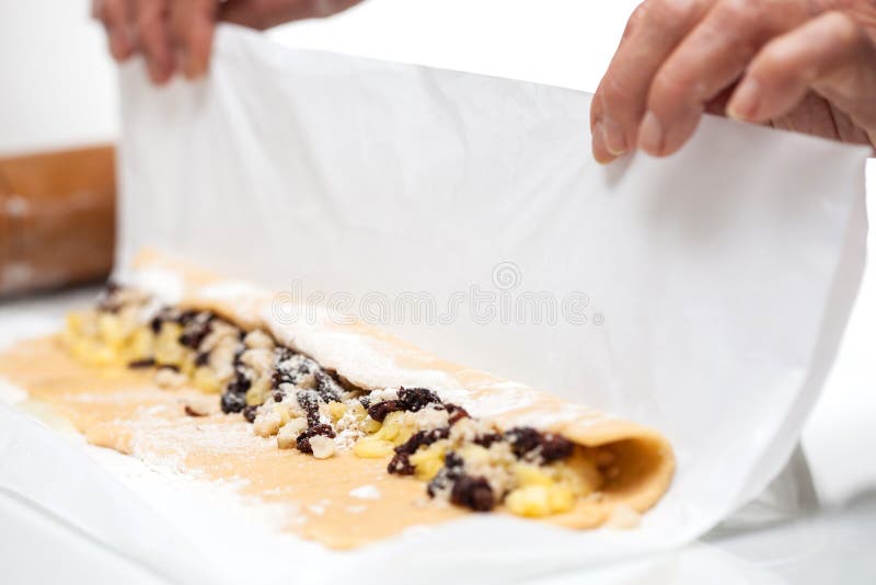Rolling up the strudel stock photo. Image of raisins - 74414378