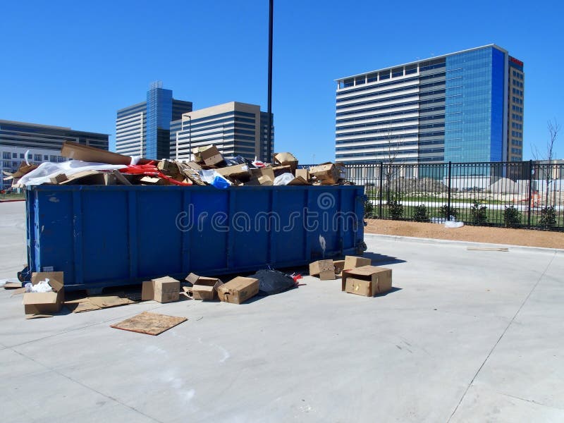 Rolloff Dumpster Full of Boxes and Trash at an Office Complex Stock ...