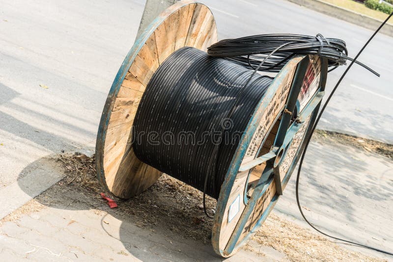 Rolls of Black Electric Cables Stock Image - Image of power, abstract ...