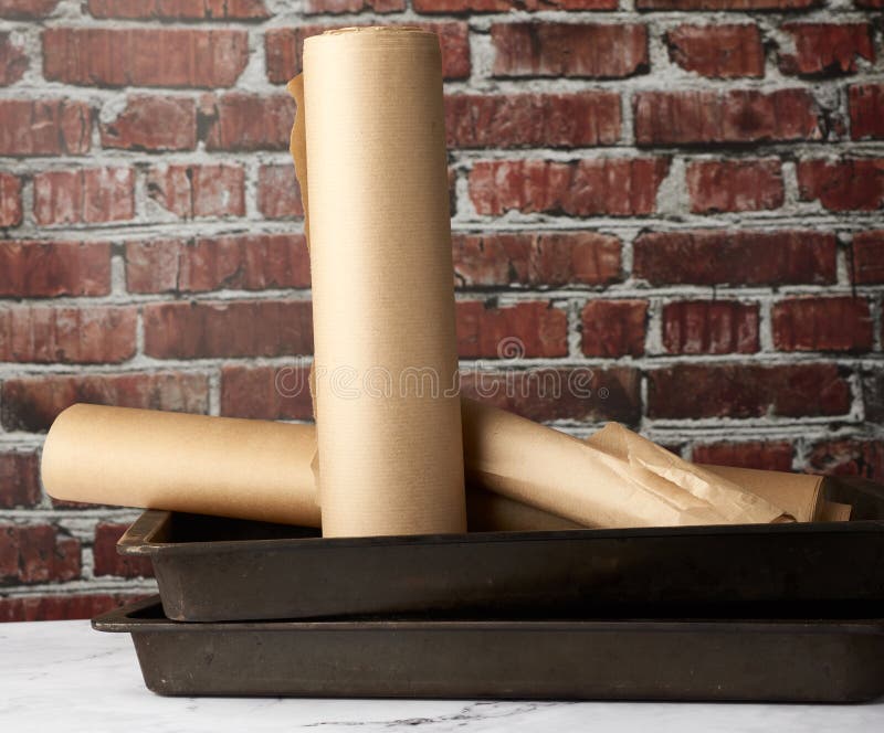 Rolls of Brown Parchment Paper on a White Table Stock Photo - Image of ...