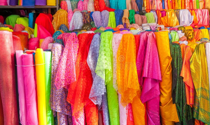 Rolls Colorful of Brightly Coloured Fabrics and Cloths Store Stock ...
