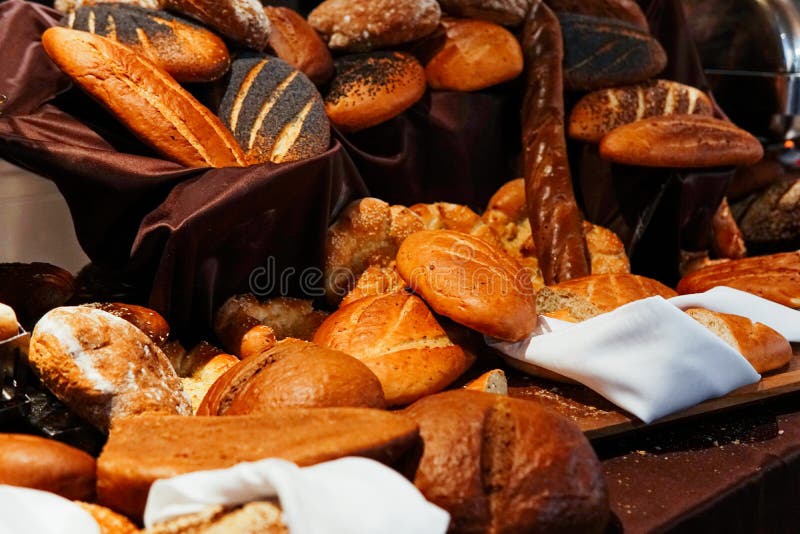 Many Rolls of Different Breads in the Bakery Restaurant Stock Photo ...