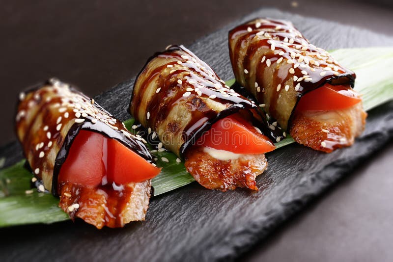 The Rolls of Eggplant Stuffed with Eel Stock Photo - Image of plate ...