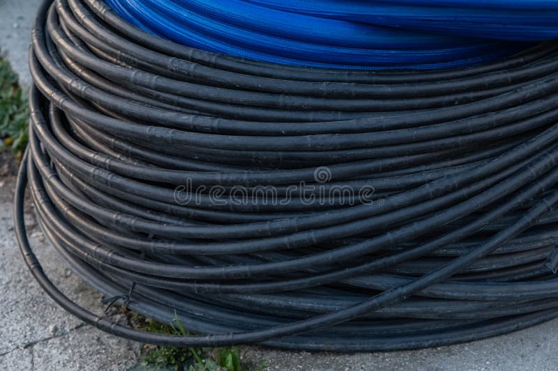 Rolls of Electrical Wire. a Close-up of a Tangled Pile of Black ...