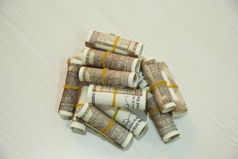 Stack of Indian 10 Rupee Currency Note Rolls on the Chart Paper Stock ...