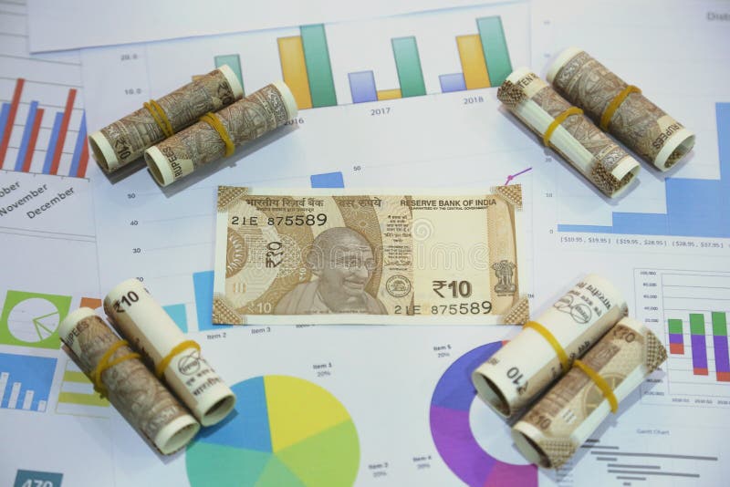 Rolls of Indian 10 Rupee Currency Notes and One Open 10 Rupee Note on ...