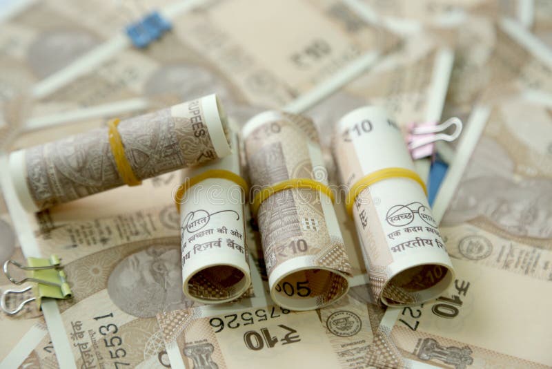 Rolls of Indian 10 Rupee Currency Notes and One Open 10 Rupee Note on ...