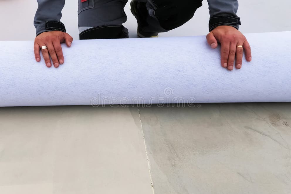 Rolls of Polymer Coating for Roof. Deployment of a Roof Covering Roll ...