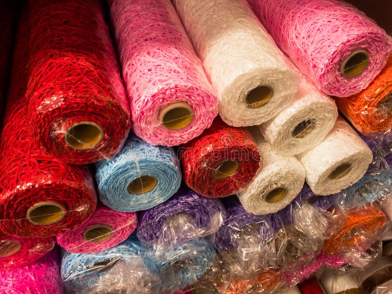 Rolls of Textured Decorative Wrapping Paper of Different Colors on the ...