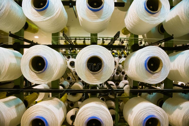 Rolls of white thread stock photo. Image of manufacturing - 212583568