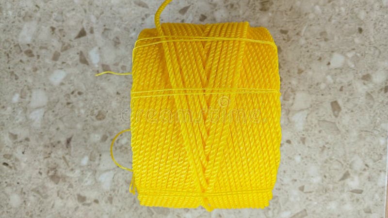 Rolls of Yellow Nylon Rope Neatly Arranged. Yellow Plastic Rope Stock ...