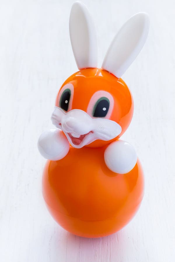 Roly-poly Toy Rabbit in Orange on a White Background Stock Photo ...