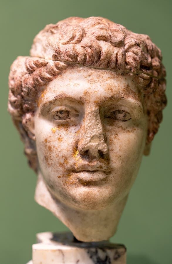 Close-up on Head of Ancient Roman Statue in Ruins Portraiting a Young ...
