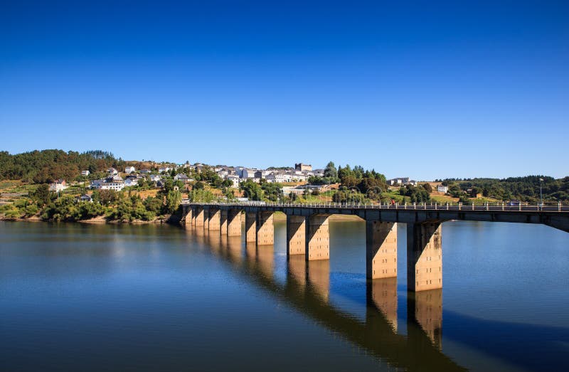 Roman Bridge Over the Minho River in Portomarin Stock Photo - Image of ...