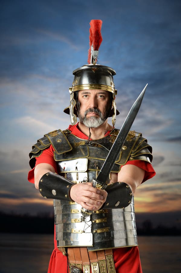 Roman Centurion Holding Sword Stock Image - Image of roman, armor: 42659285