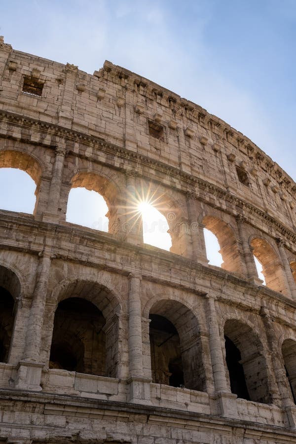 Roman Colosseum at Sunset with Sun Rays Coming through the Structure ...