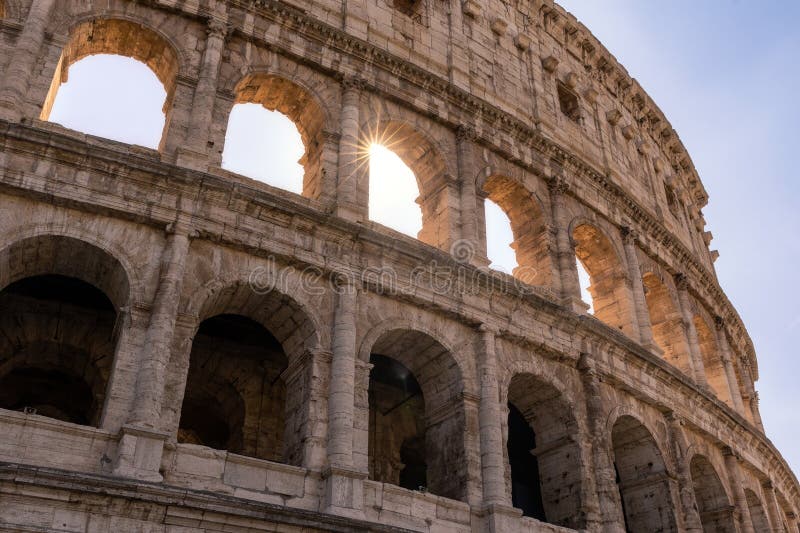 Roman Colosseum at Sunset with Sun Rays Coming through the Structure ...
