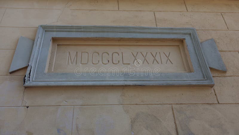 Roman Figures Engraved in Stone on a Wall Stock Image - Image of ...