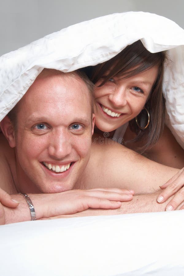 Romance in the bed stock photo. Image of looking, hand - 8112528