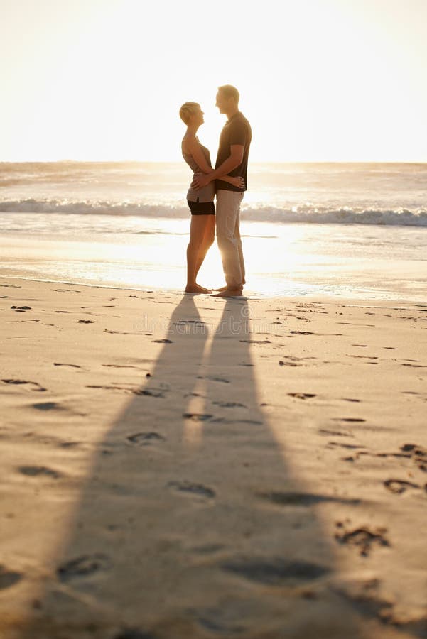 Romance at Sunset. a Mature Couple Enjoying a Day at the Beach. Stock Image - Image of male ...