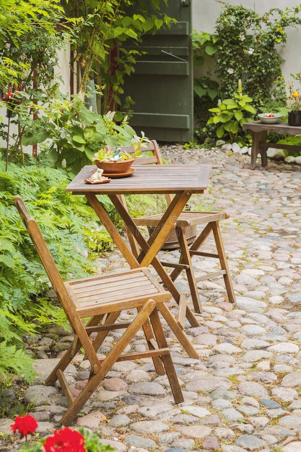 Romantic backyard setting stock photo. Image of cobbles - 79375864