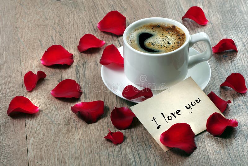 Romantic Coffee. Cup of Coffee and Red Rose Petals on the Table. Coffee ...