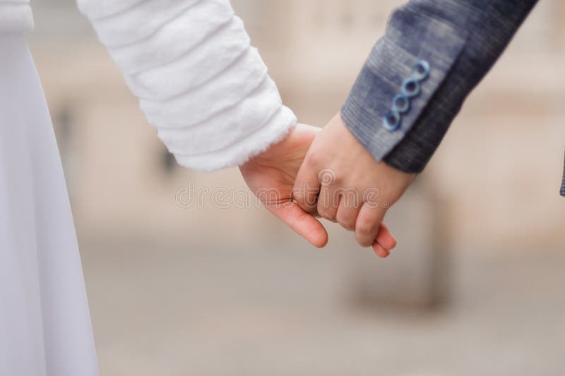 Romantic Connection: a Close-Up of Two Hands Interlocking in Unity ...