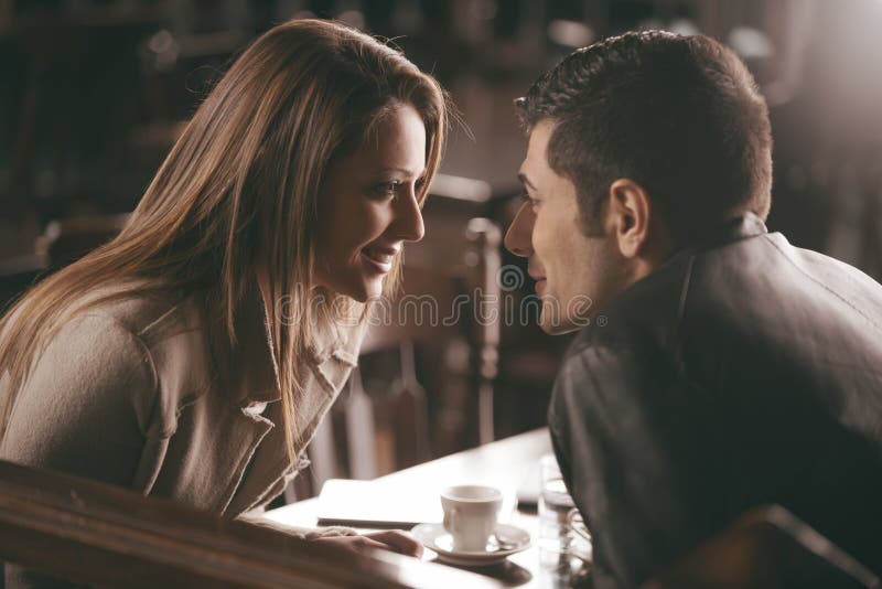 Romantic couple at the bar stock photo. Image of flirting - 56680056