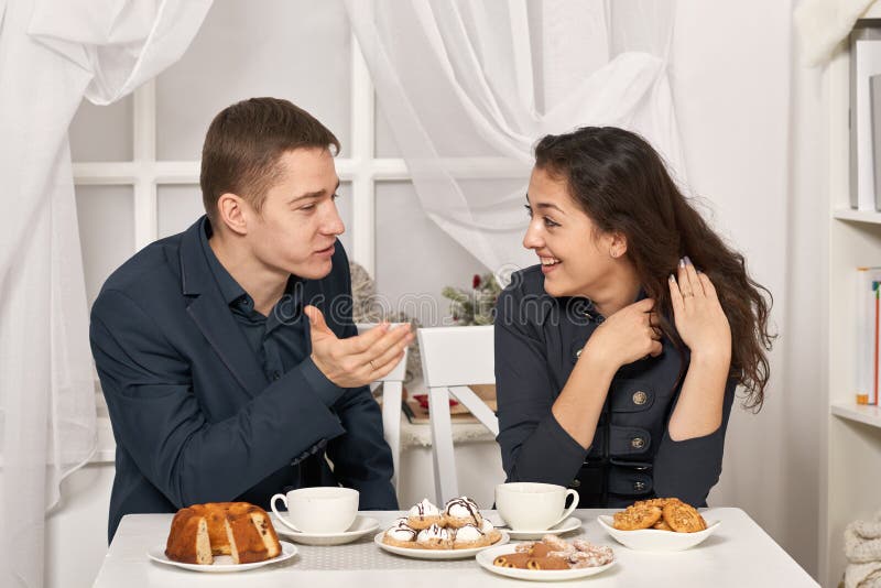 Romantic Couple Drinking Tea with Cookies and Talking Stock Image ...