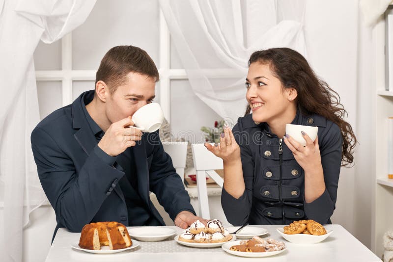 Romantic Couple Drinking Tea with Cookies and Talking Stock Image ...