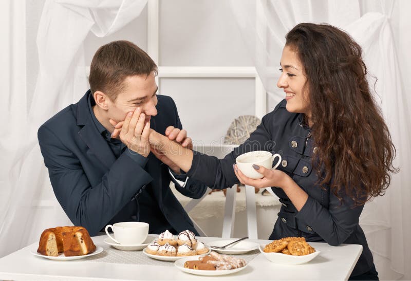 Romantic Couple Drinking Tea with Cookies and Talking Stock Image ...