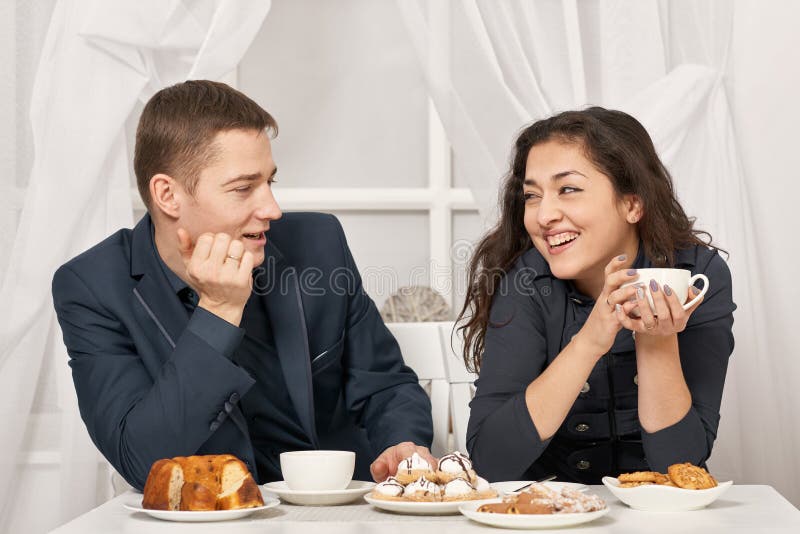 Romantic Couple Drinking Tea with Cookies and Talking Stock Image ...