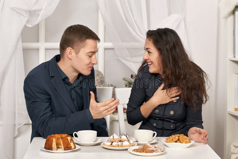 Romantic Couple Drinking Tea with Cookies and Talking Stock Photo ...
