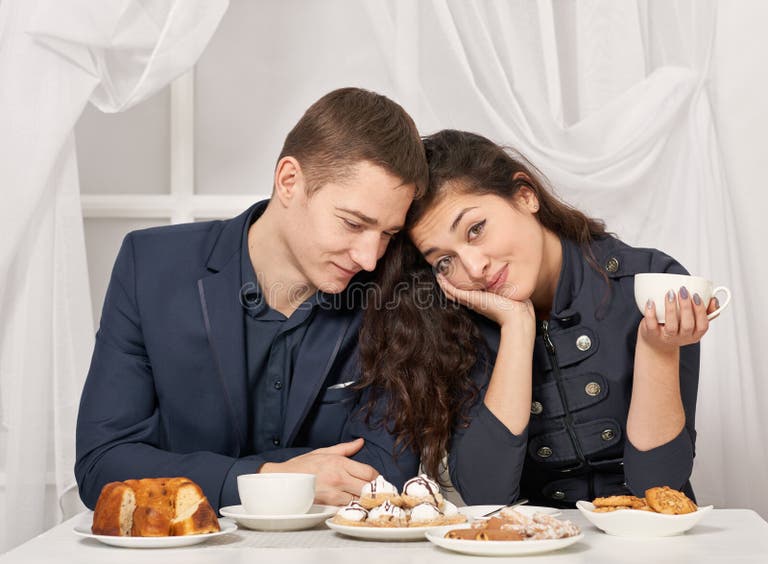 Romantic Couple Drinking Tea with Cookies and Talking Stock Image ...