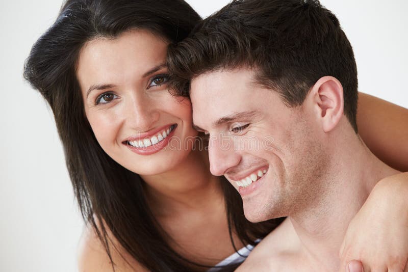 Romantic Couple Embracing Against White Studio Background Stock Image ...