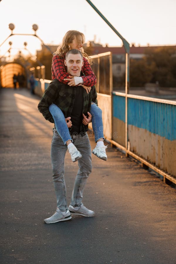 Romantic Couple Embracing Sunshine on a Bridge Stock Image - Image of ...