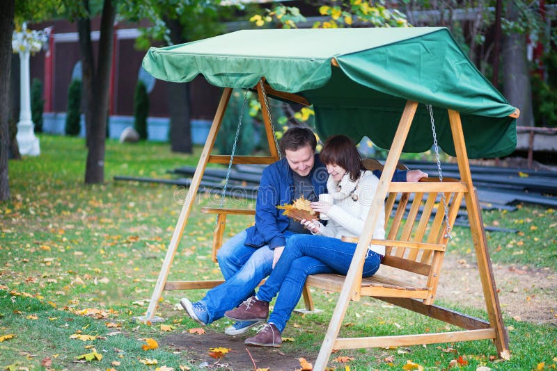 Romantic Couple Having Fun Together on the Swing Stock Image - Image of ...