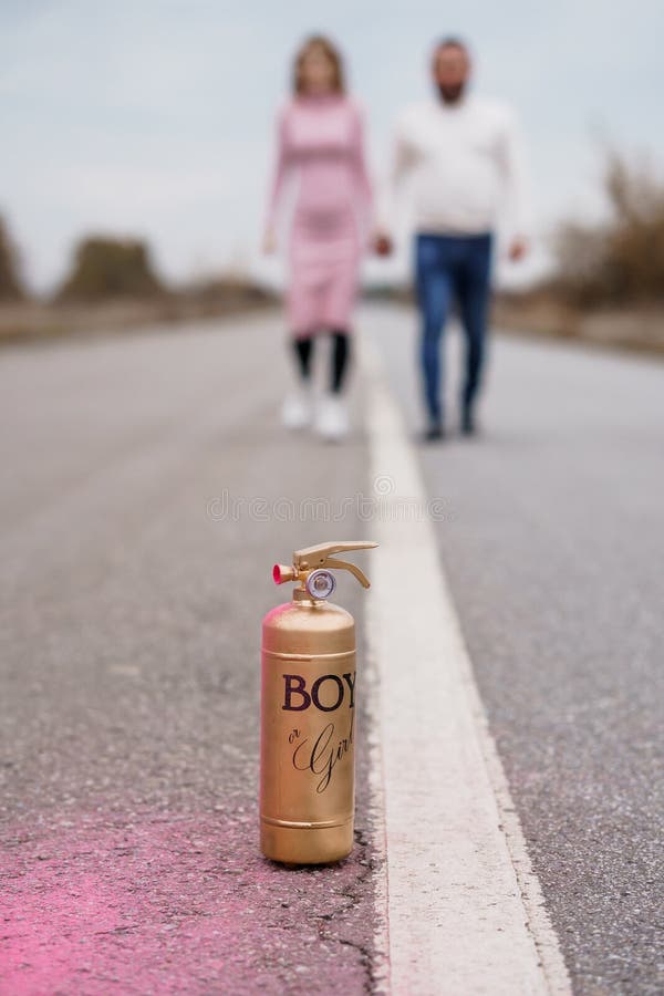 Romantic Couple Holding Hands on a Road with a Decorative Fire ...