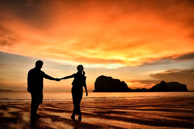 Romantic Couple Holding Hands At Sunset On Beach Stock Photo - Image ...