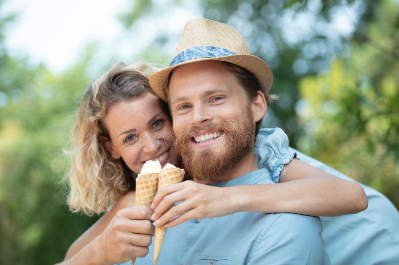 Romantic Couple with Ice Cream Stock Image - Image of looking, sharing ...