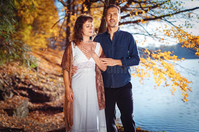 Romantic Couple in Love by the Lake in Autumn. Stock Image - Image of ...