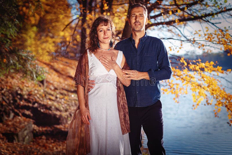 Romantic Couple in Love by the Lake in Autumn. Stock Photo - Image of ...