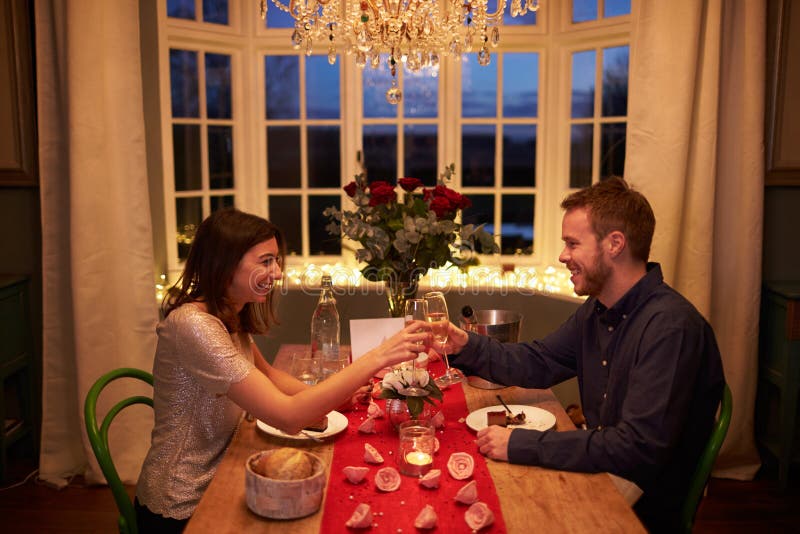 Romantic Couple Make a Toast at Valentines Day Meal Stock Image - Image ...