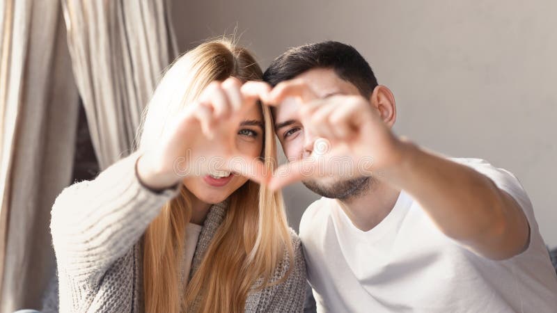 Beautiful Couple Making Heart with Their Hands at Home Stock Image ...